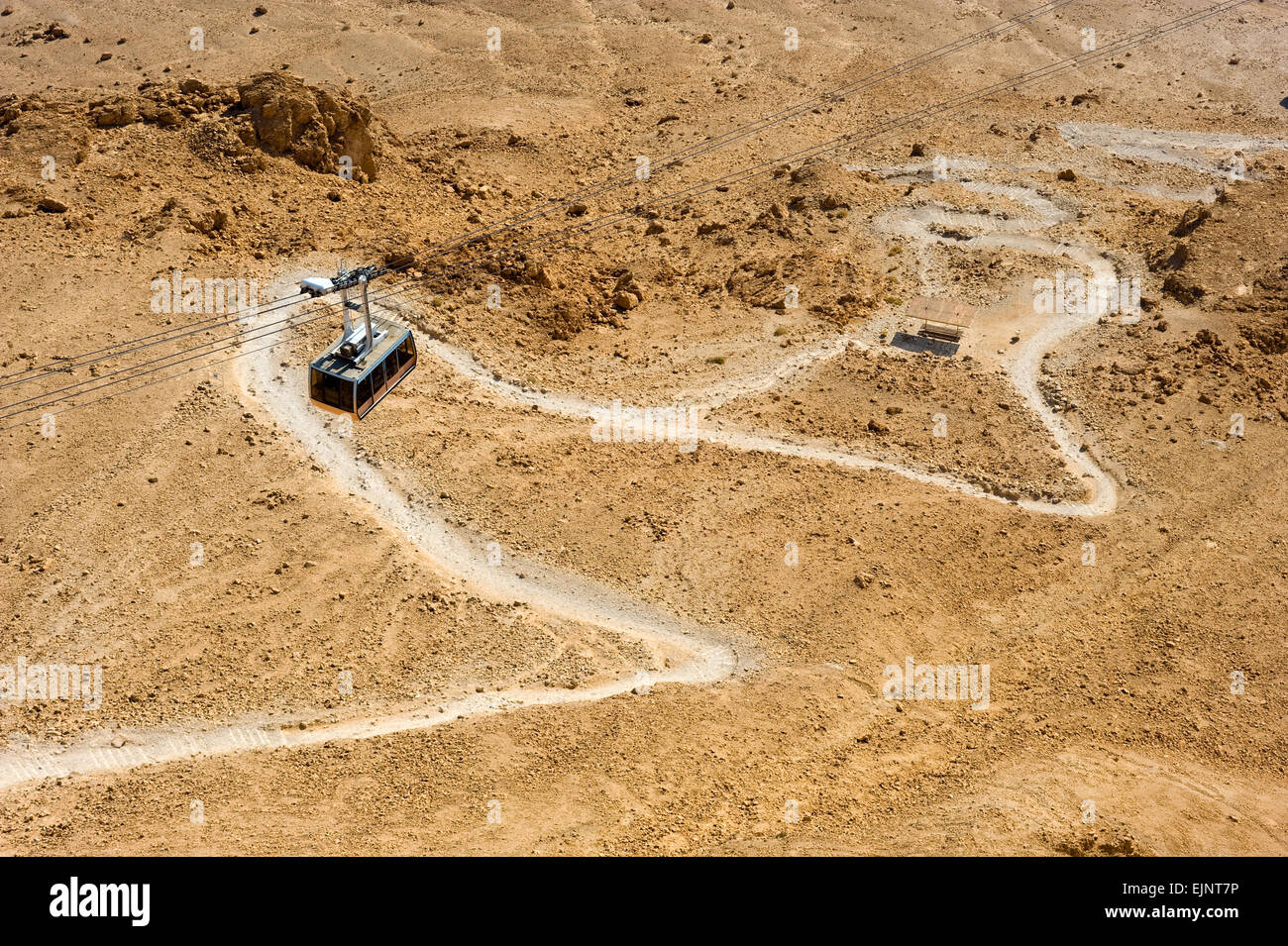 Cable car that brings people to the top of Masada, down you can see ...