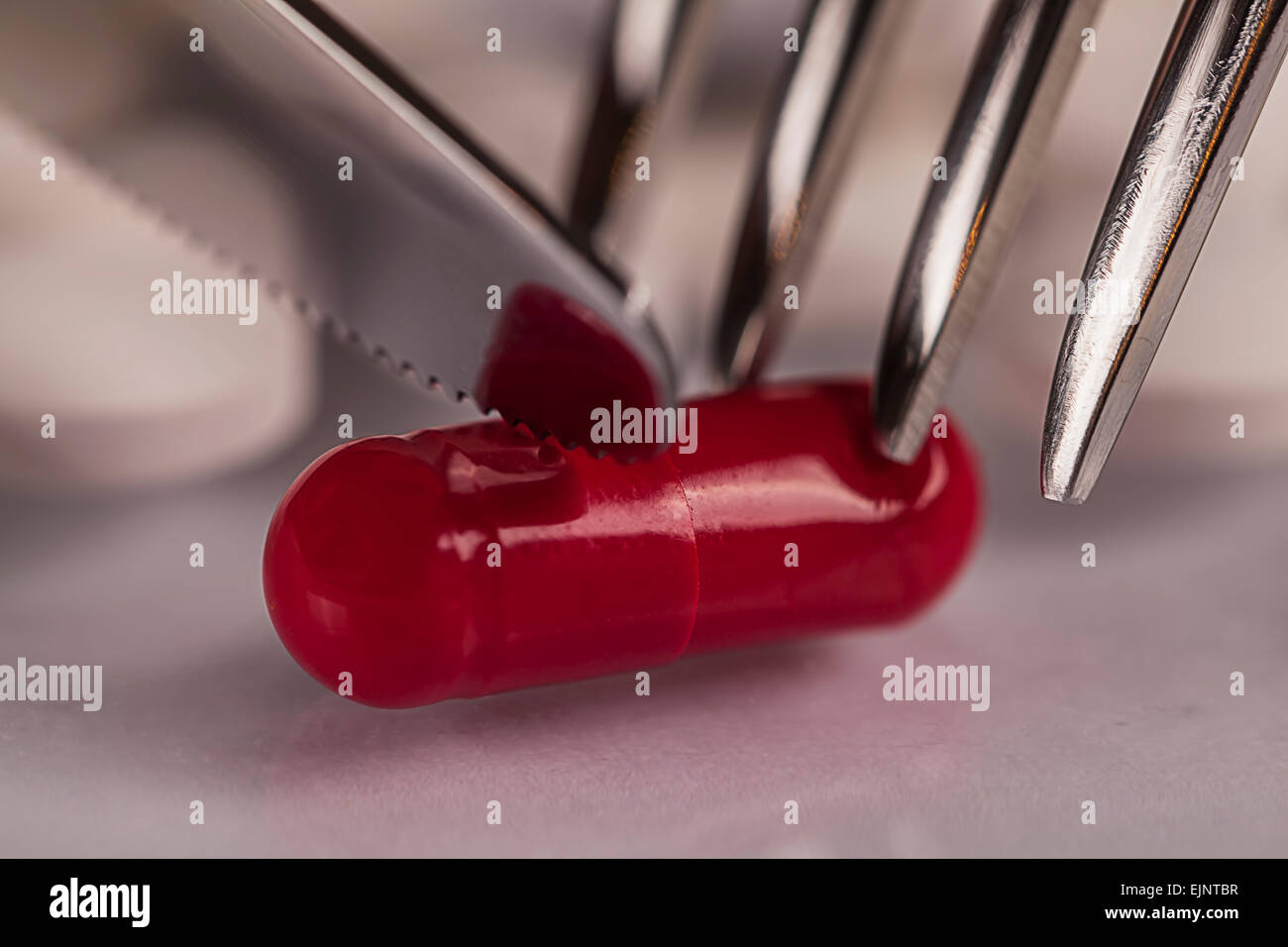 Pill with knife and fork, details Stock Photo - Alamy