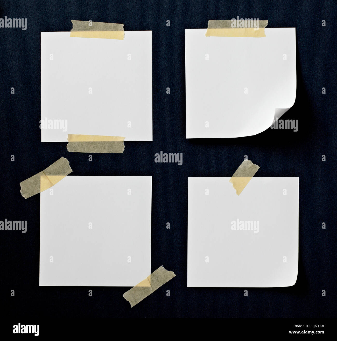 close up of note paper with adhesive tape on a black background Stock ...