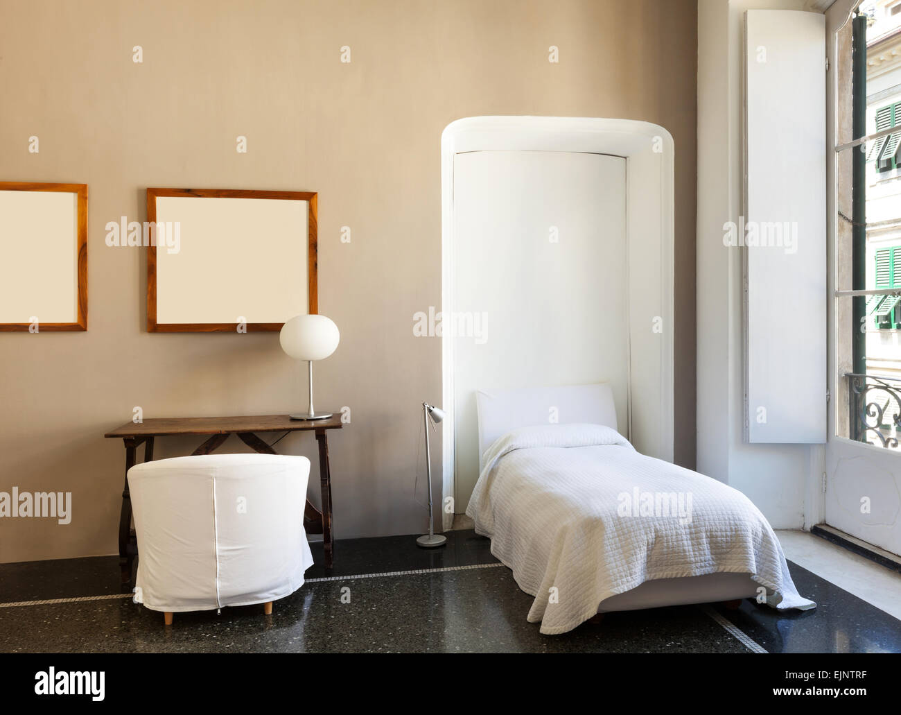 beautiful hotel room in historic building, view single bed Stock Photo ...