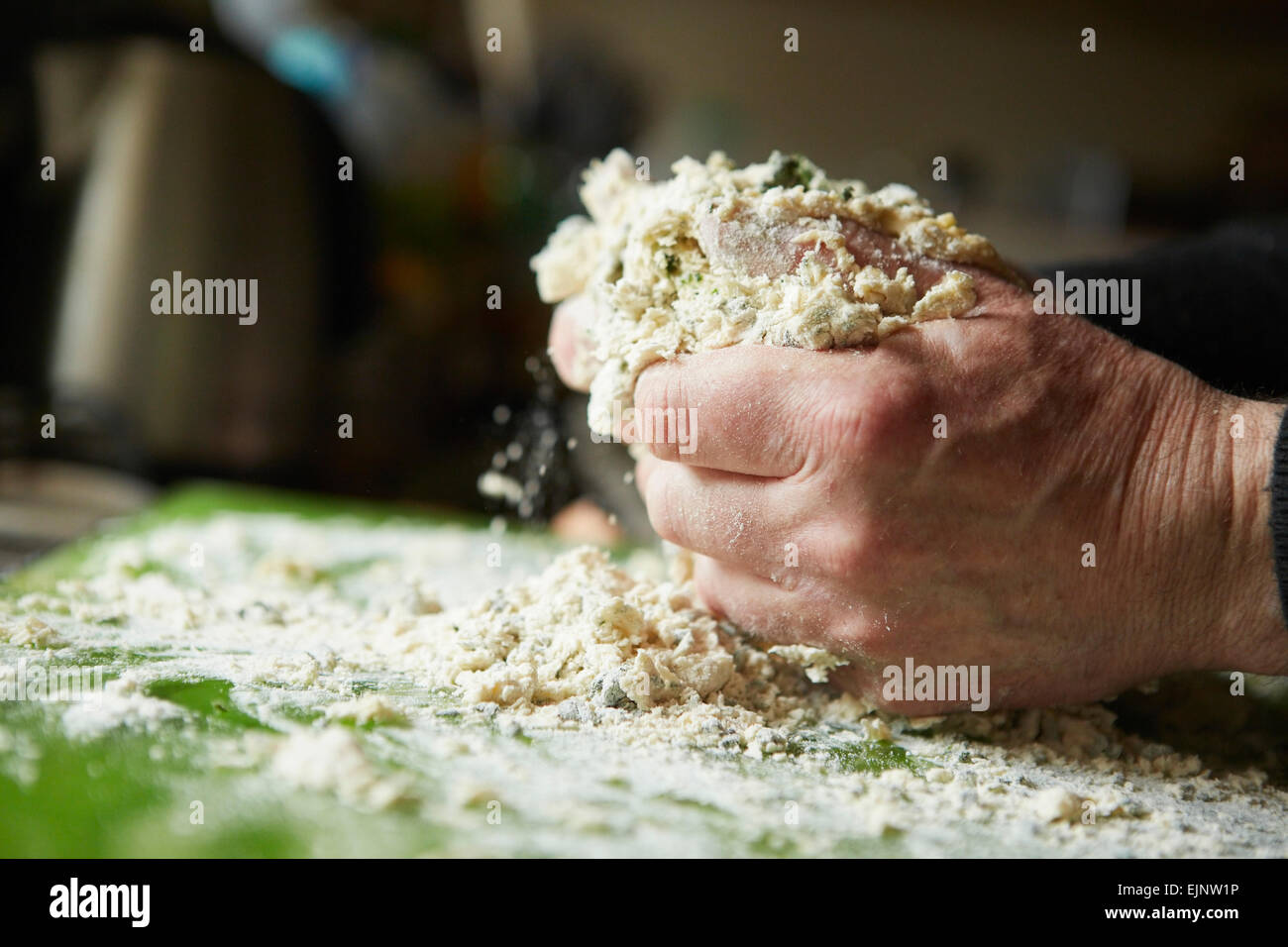 A man mixing flour for fresh pasta Stock Photo - Alamy