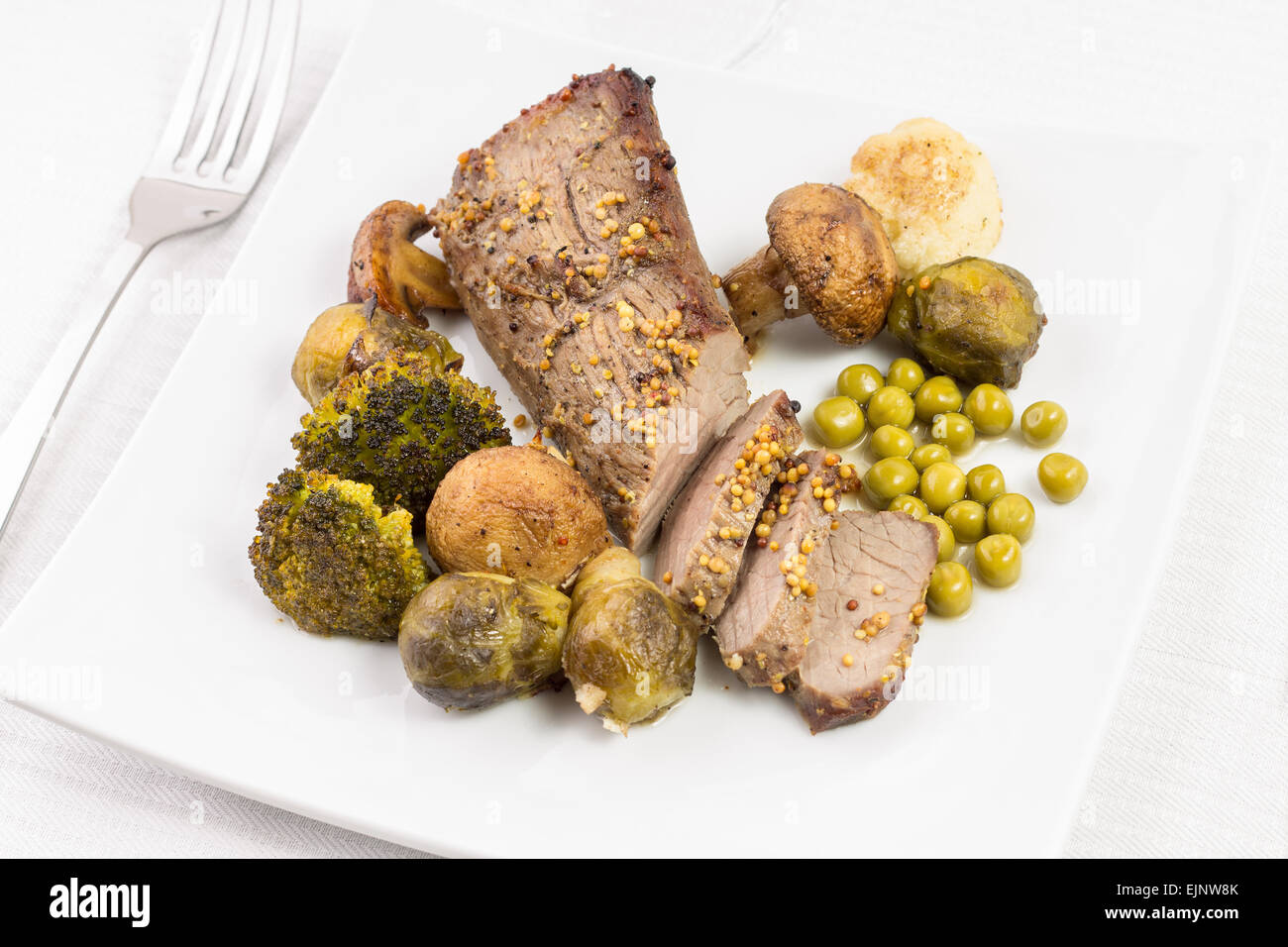 Cut in slices roast beef with grilled mushrooms, broccoli and brussels ...