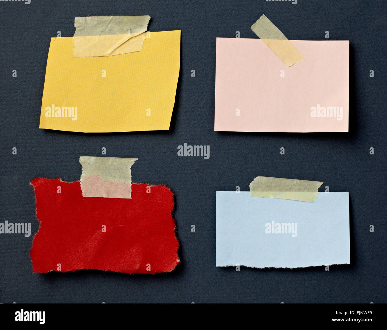 close up of note paper with adhesive tape on a black background Stock ...