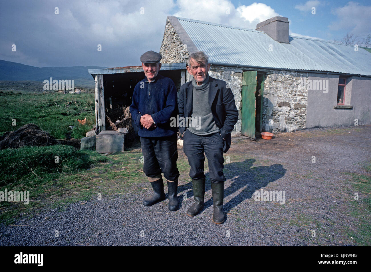 Blue Stack Mountains farmers outside cottage, Donegal, Ireland Stock ...