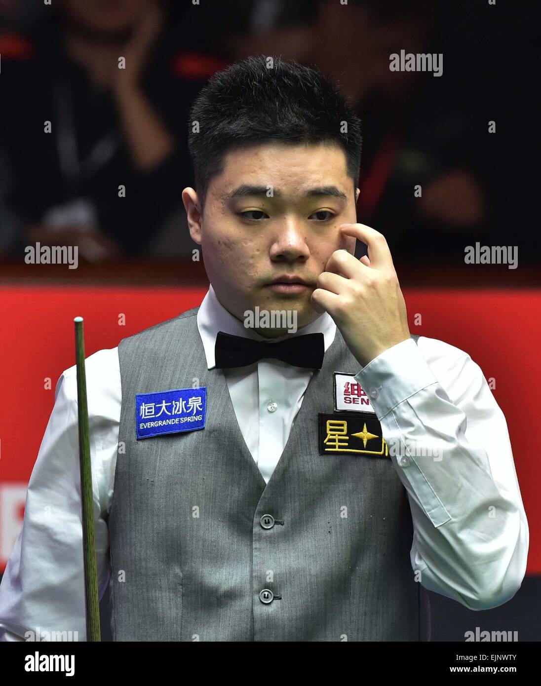 Beijing, China. 30th Mar, 2015. Ding Junhui of China gestures during ...