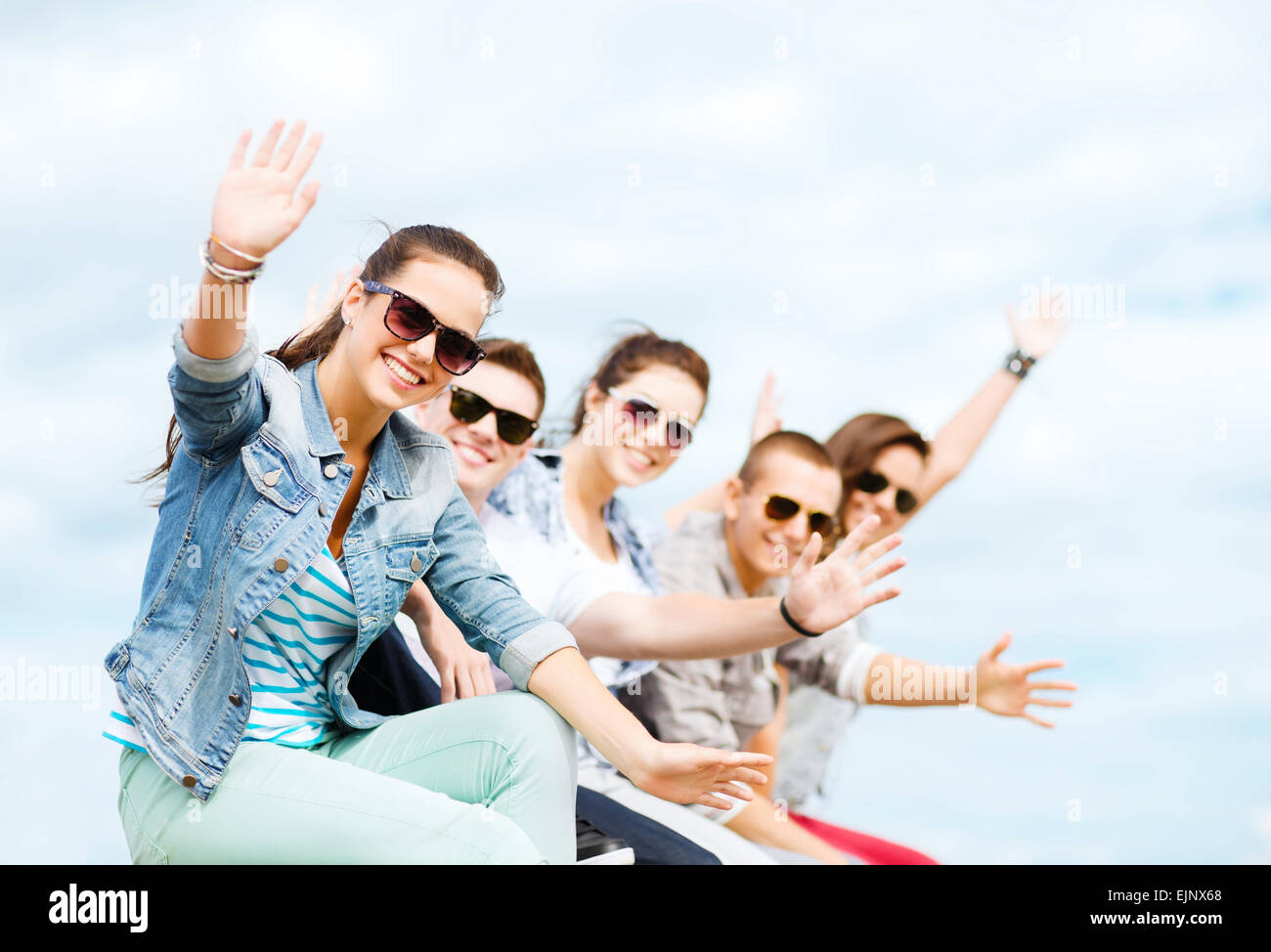 group of teenagers waving hands Stock Photo - Alamy