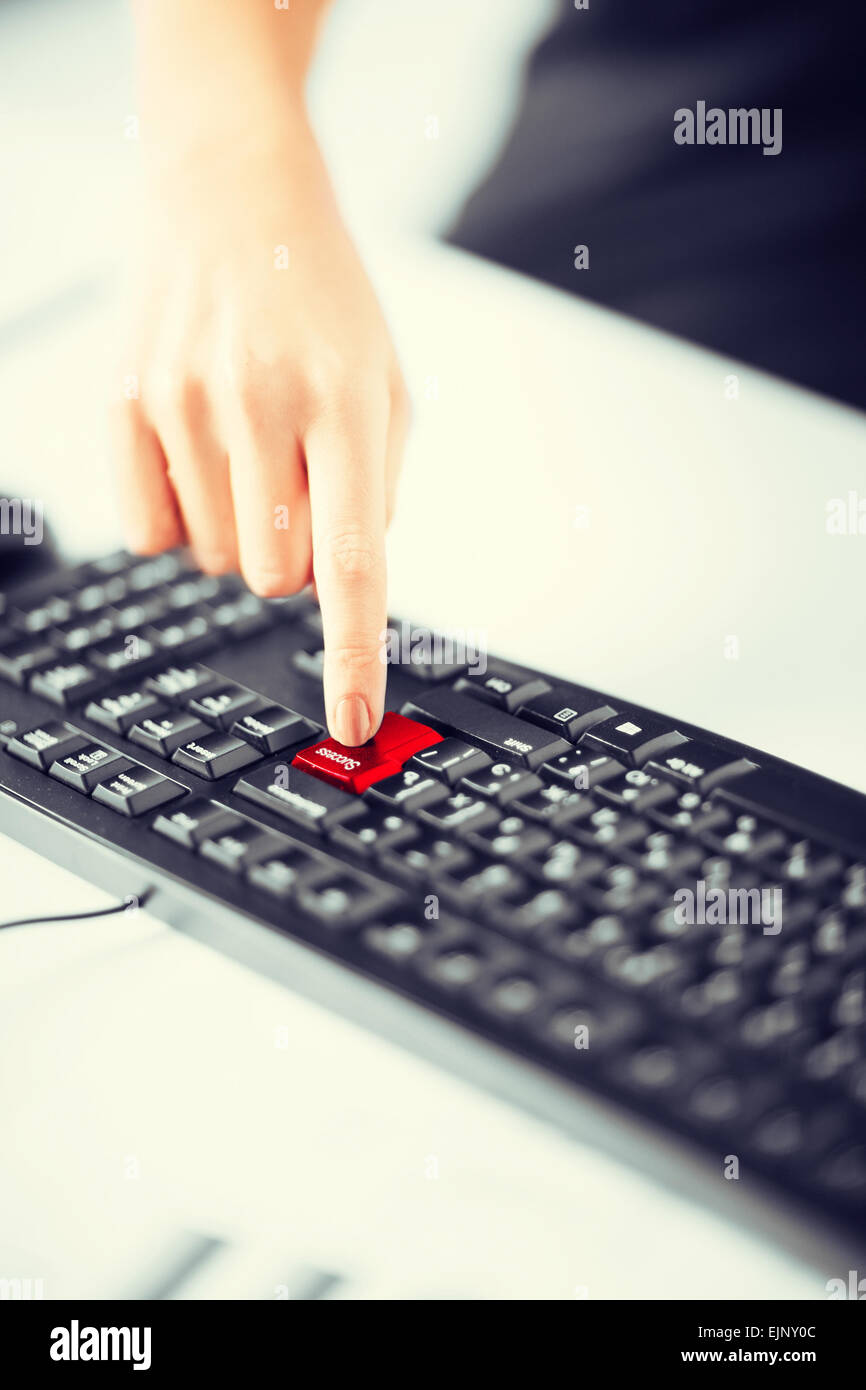 hand pressing success button on keyboard Stock Photo - Alamy