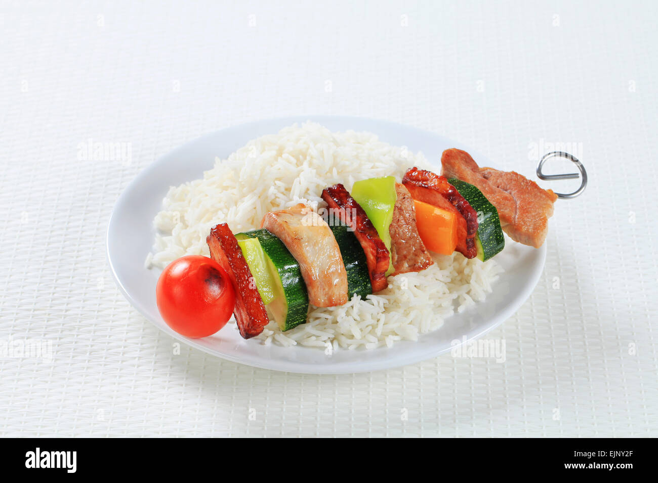 Shish kebab with white rice Stock Photo - Alamy