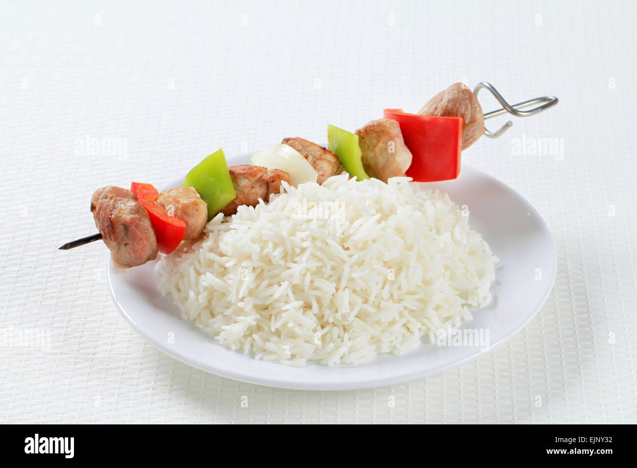 Shish kebab with white rice Stock Photo - Alamy