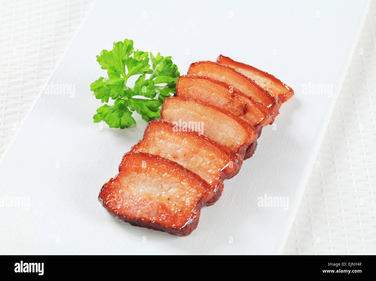 Pan fried pieces of salt pork Stock Photo - Alamy
