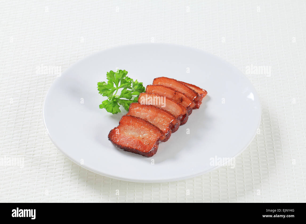 Pan fried pieces of salt pork Stock Photo - Alamy