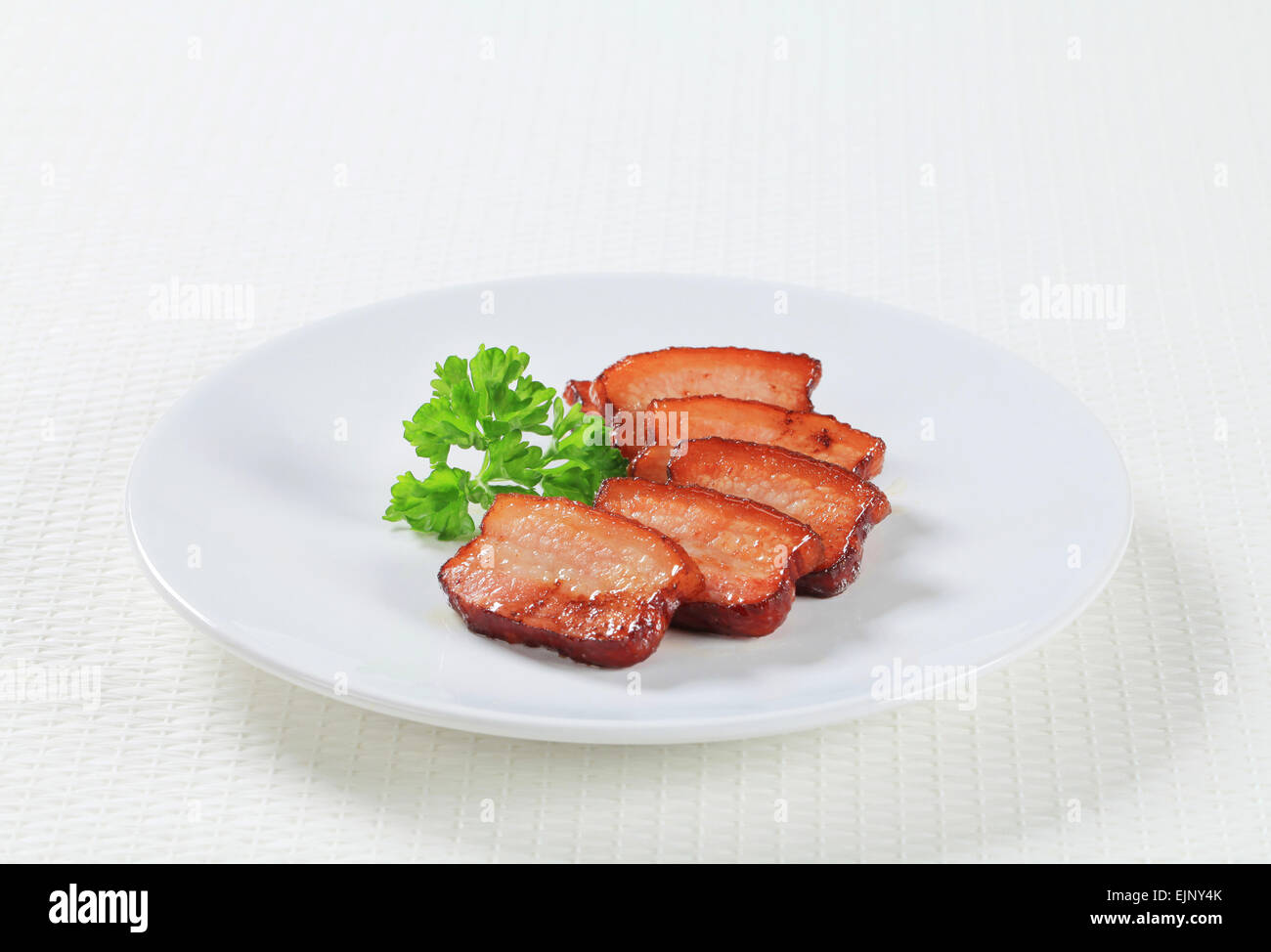Pan fried pieces of salt pork Stock Photo - Alamy