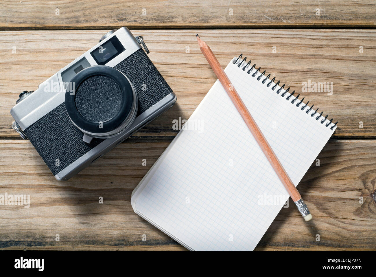 analog photographic camera and notebook over wooden surface Stock Photo ...