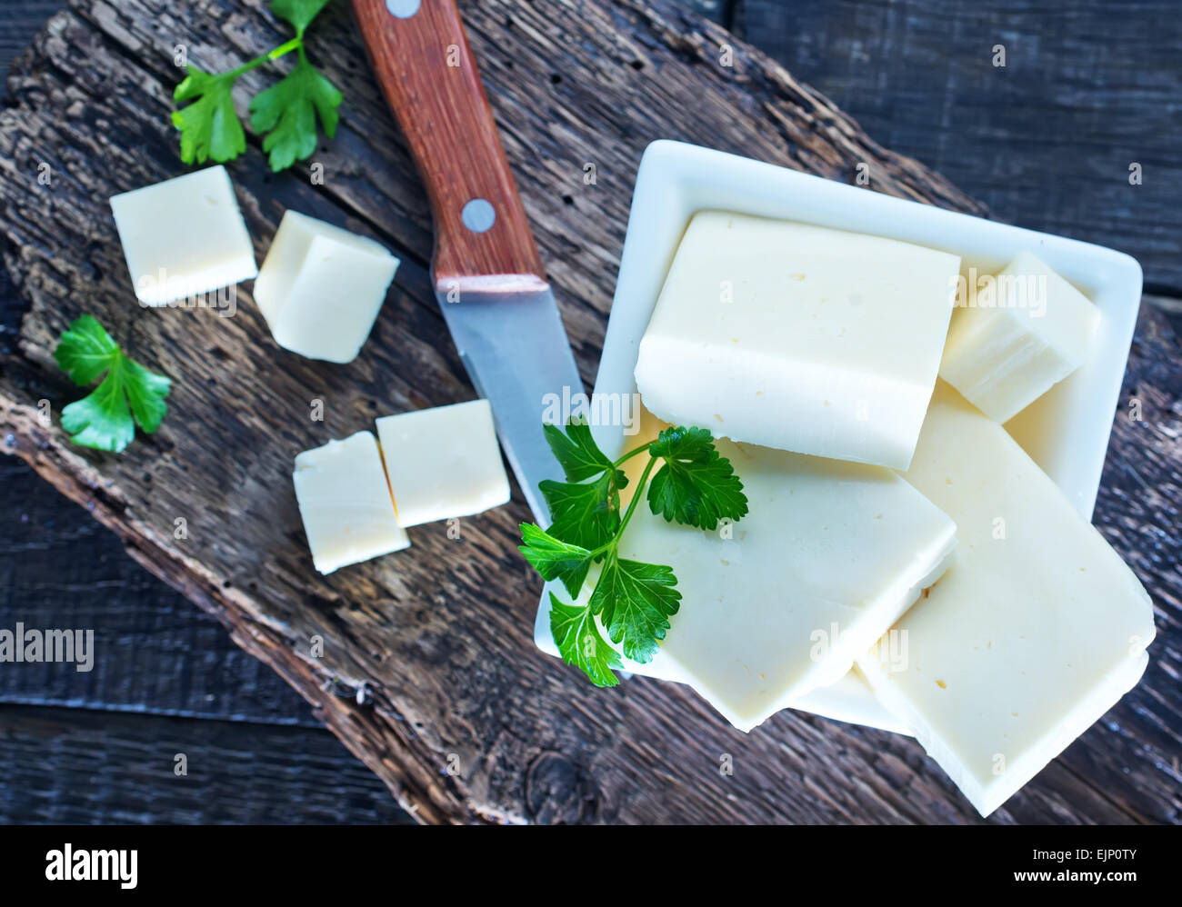 cheese in bowl and on a table Stock Photo - Alamy