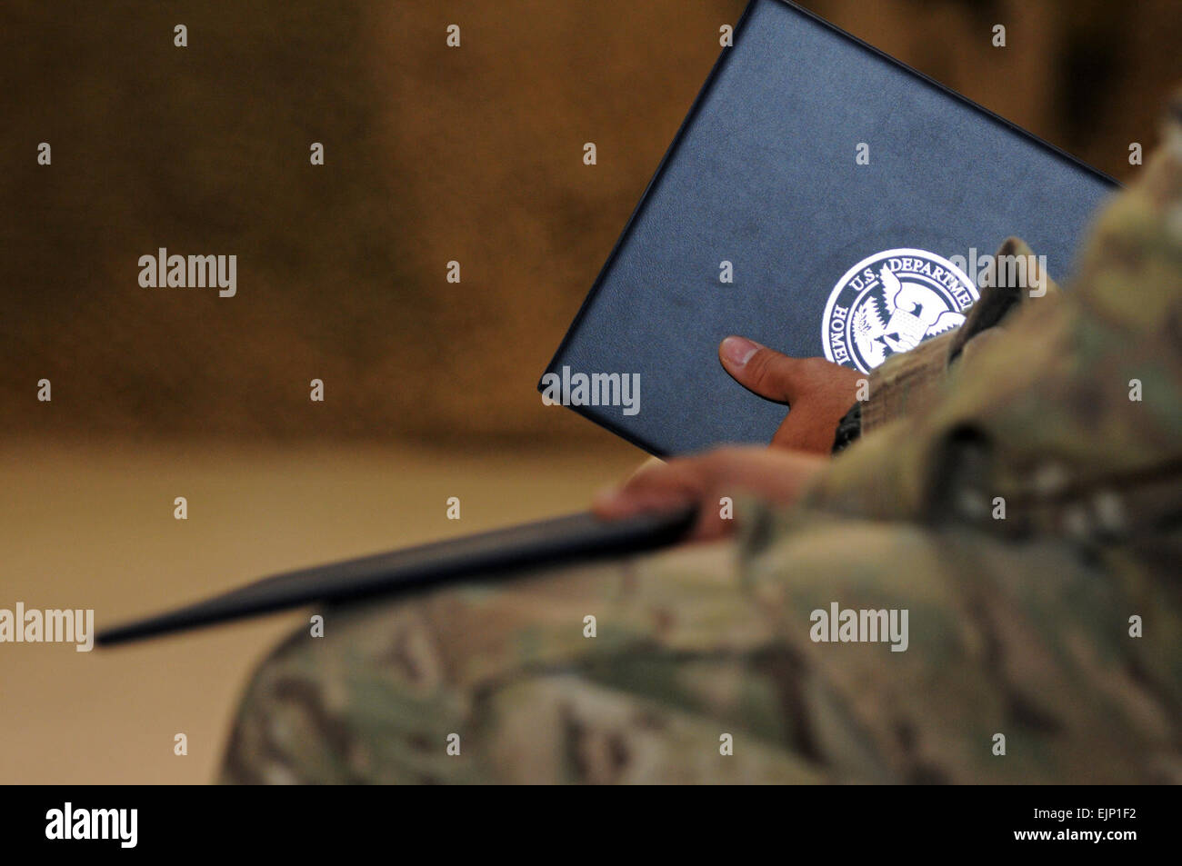 A soldier holds onto his certificate he received from the U.S ...