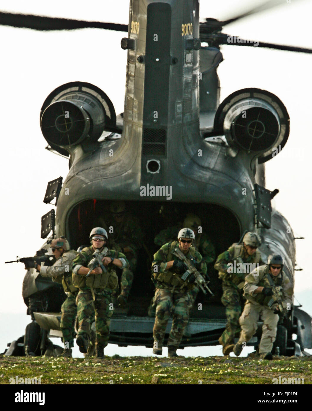 Operators from a West Coast based Navy SEAL team exit an Army CH-47D ...