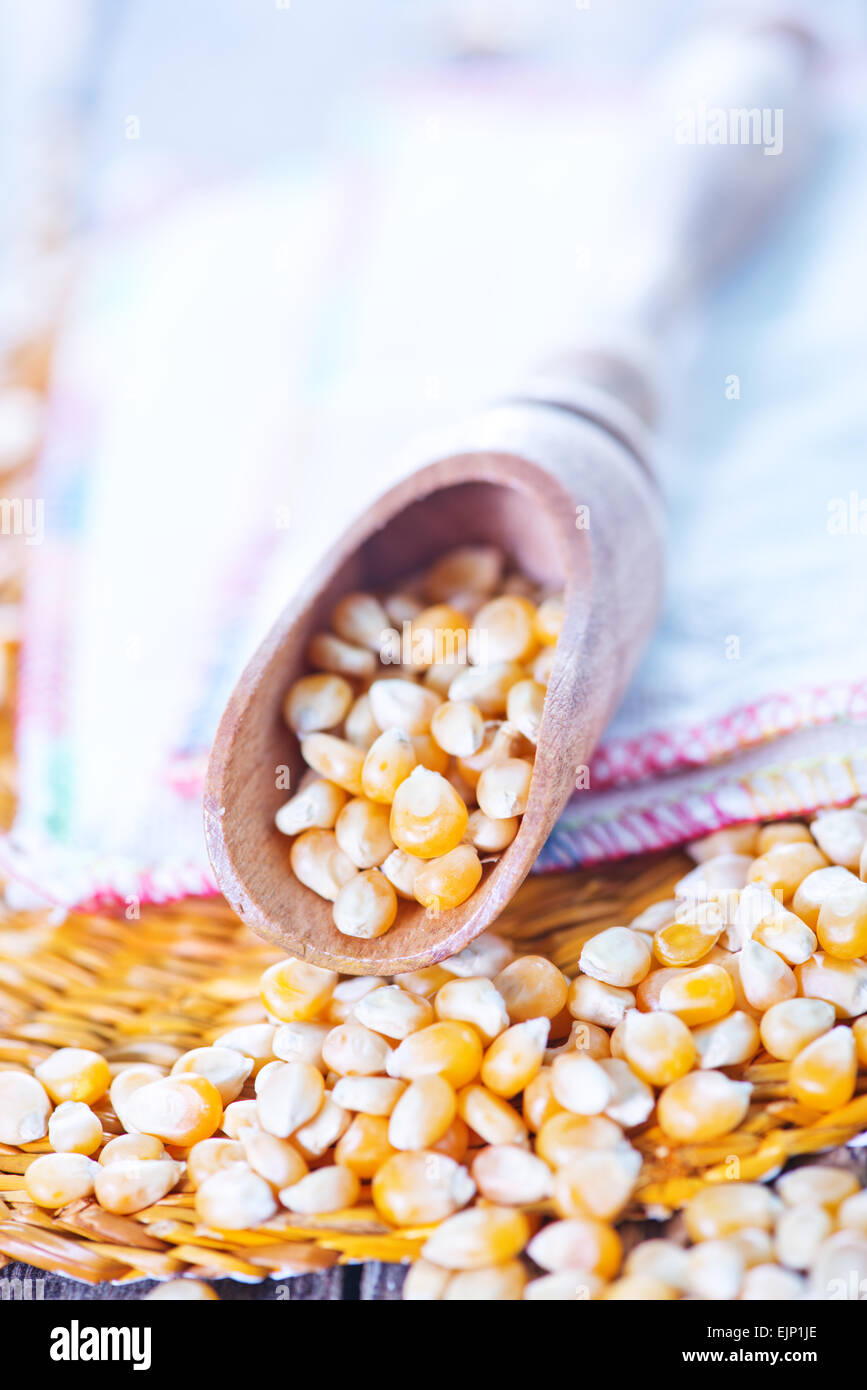 dry corn in wooden spoon and on a table Stock Photo - Alamy