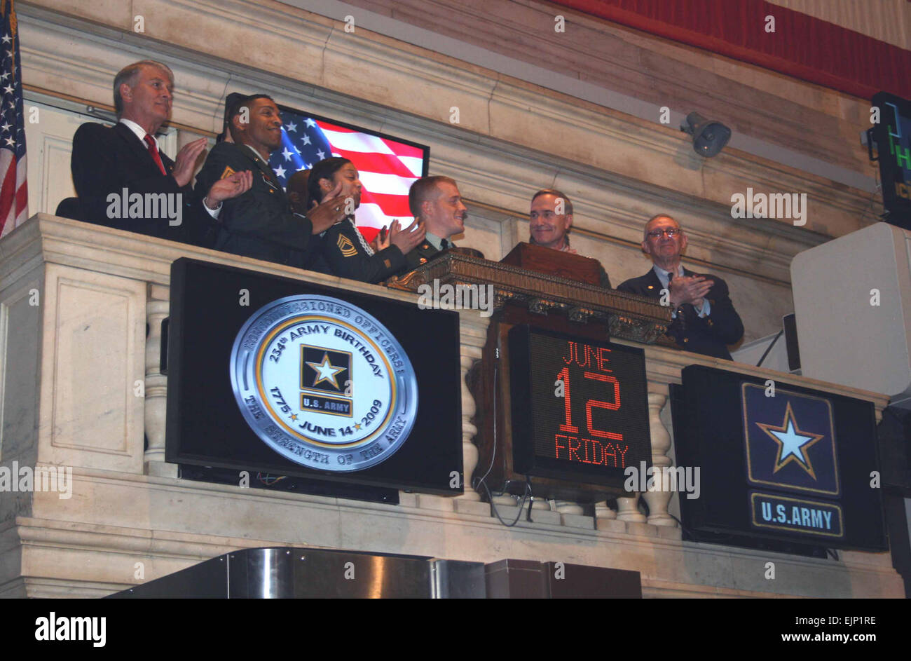 Soldiers and veterans applaud following the closing bell at the New ...