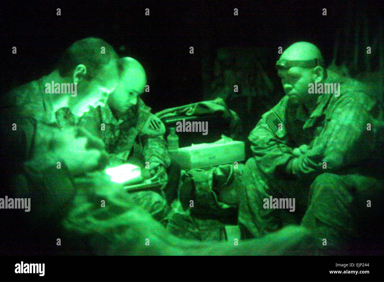 As seen through a night-vision device, U.S. Army Soldiers, members of a ...