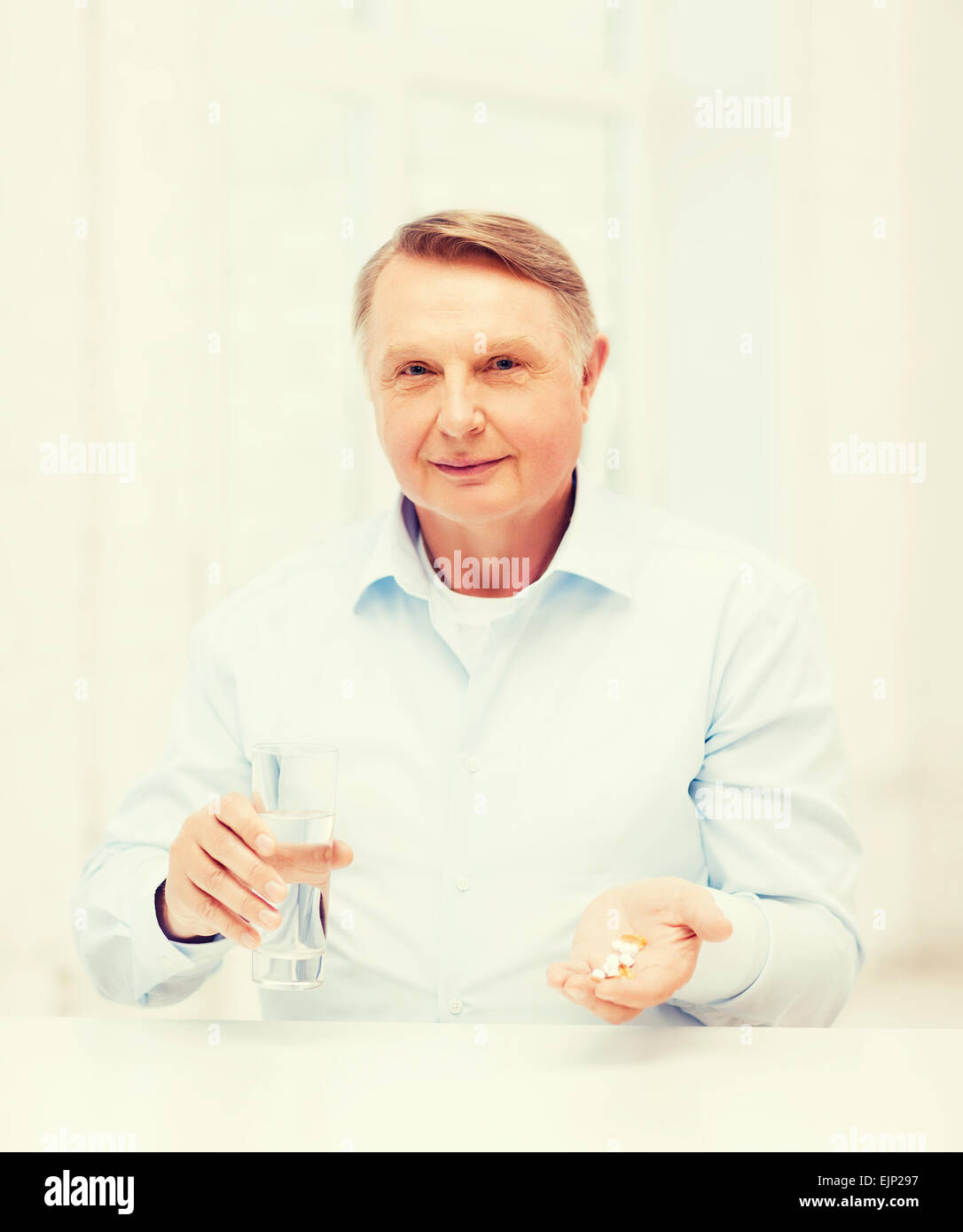 old man with pills ang glass of water Stock Photo - Alamy