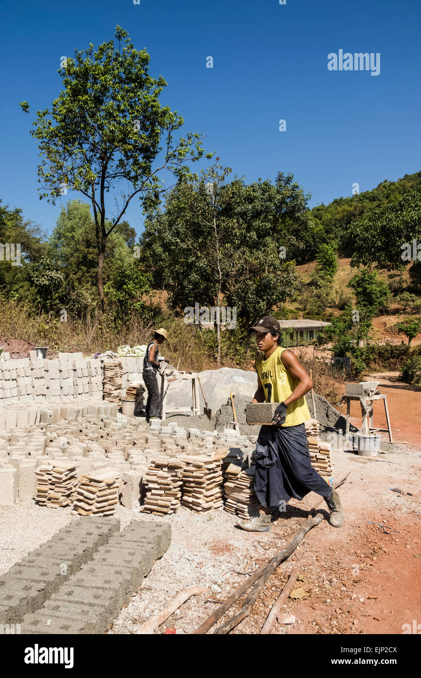 Scenes of rural Myanmar people at work making concrete blocks Stock ...
