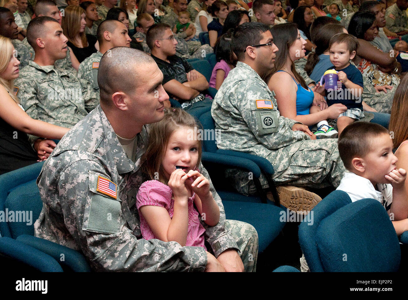 U.S. Army Pvt. Joseph Tapia sits with his daughter Kaylie during a ...