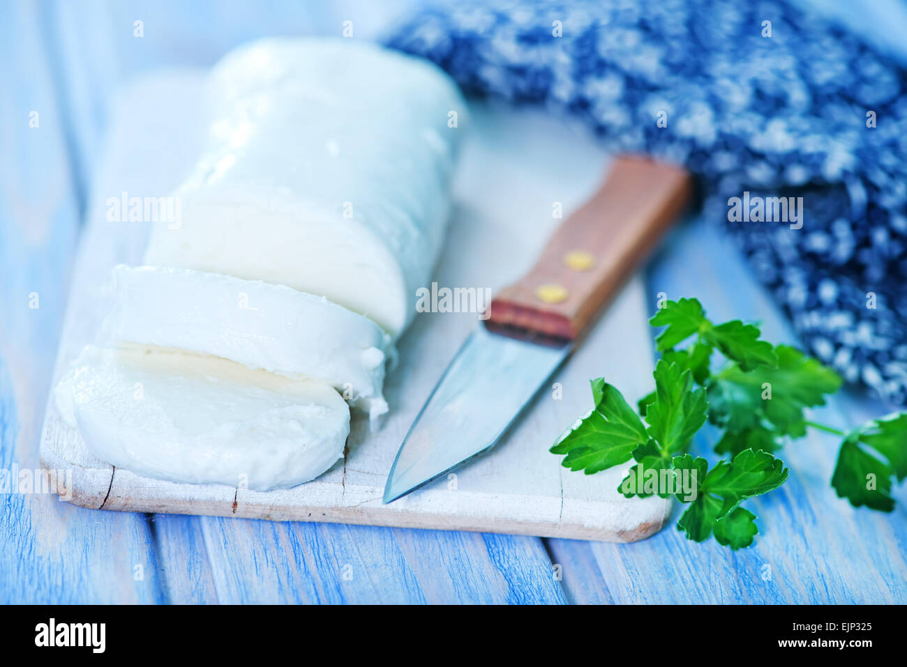 mozzarella on board and on a table Stock Photo - Alamy