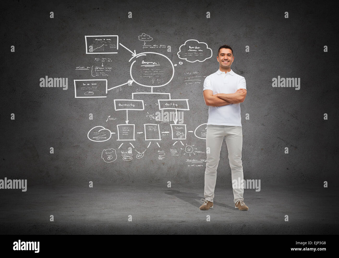 smiling man with crossed arms over scheme Stock Photo - Alamy