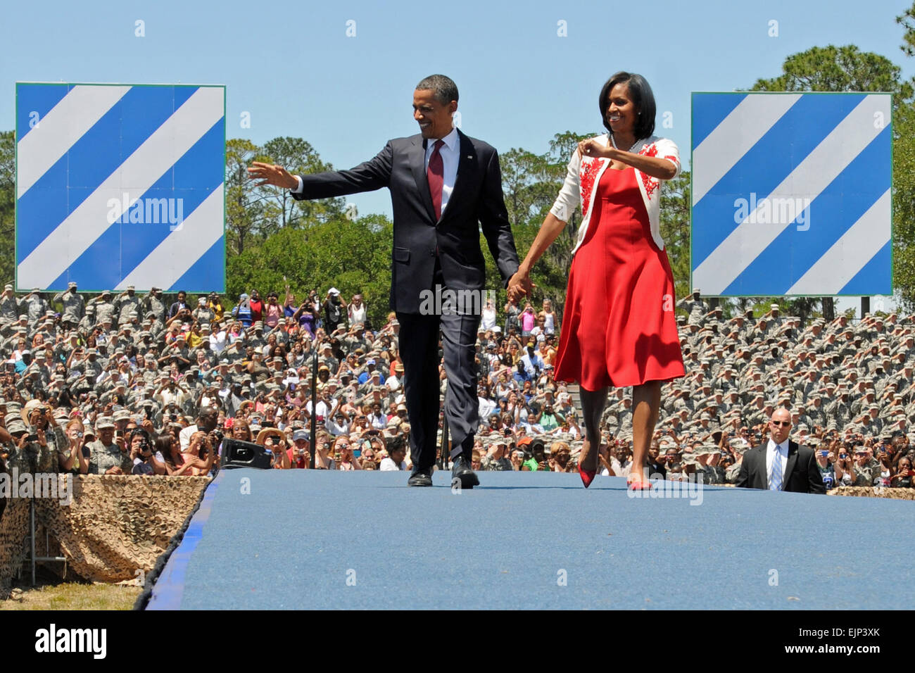 President Barack Obama and First Lady Michelle greet a crowd of more ...