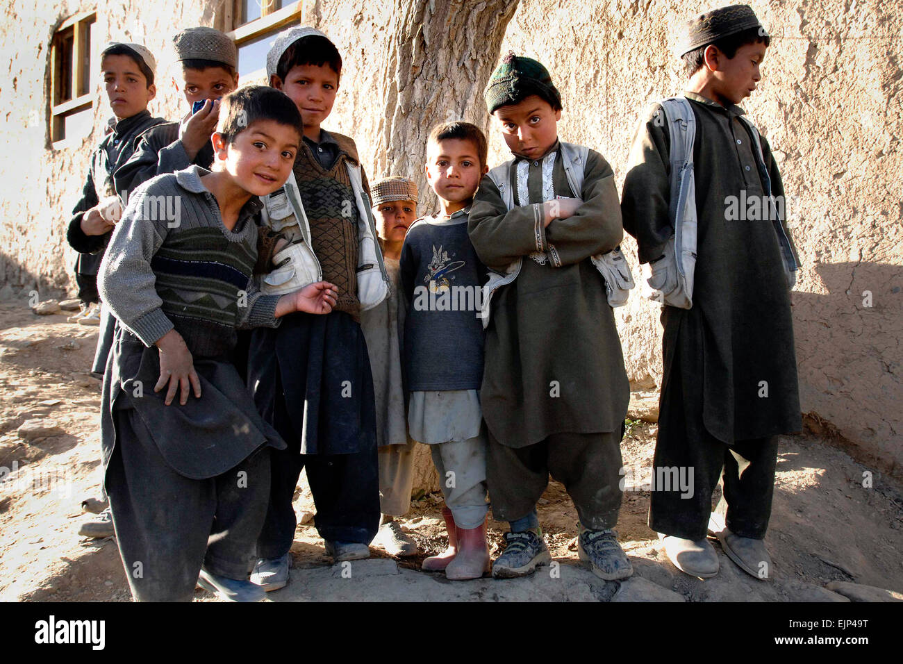 A group of kids ham it up for the camera in a small village just ...