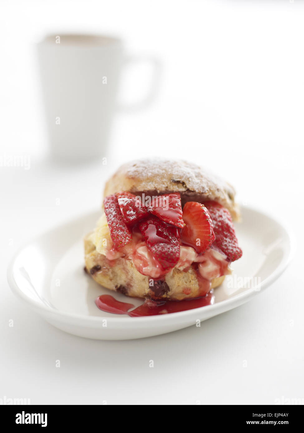 strawberry and cream scone and tea too Stock Photo - Alamy