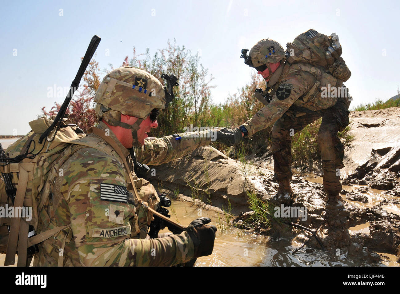Sgt. Travis Webb helps Spc. Steven Andreini, 1st Battalion, 38th ...