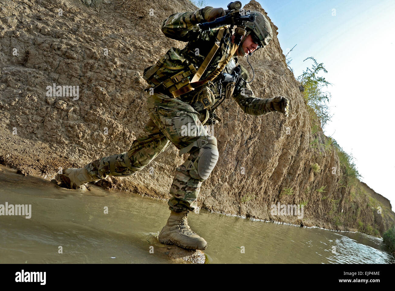 U.S. Army Sgt. 1st Class Robert Russell, platoon sergeant, crosses the ...