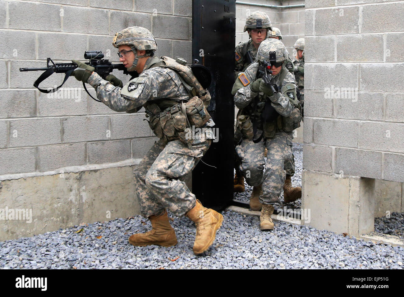 U.S. Military Academy cadets enter a room during room breach training ...