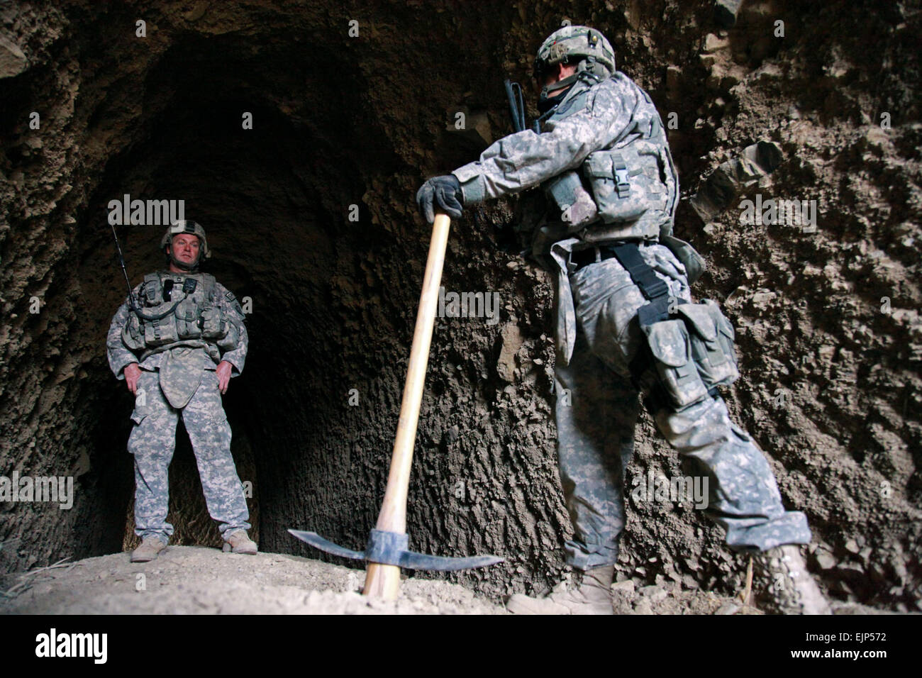U.S. Army Spc. Jonathan Araiza, right, rests after searching a cave for ...
