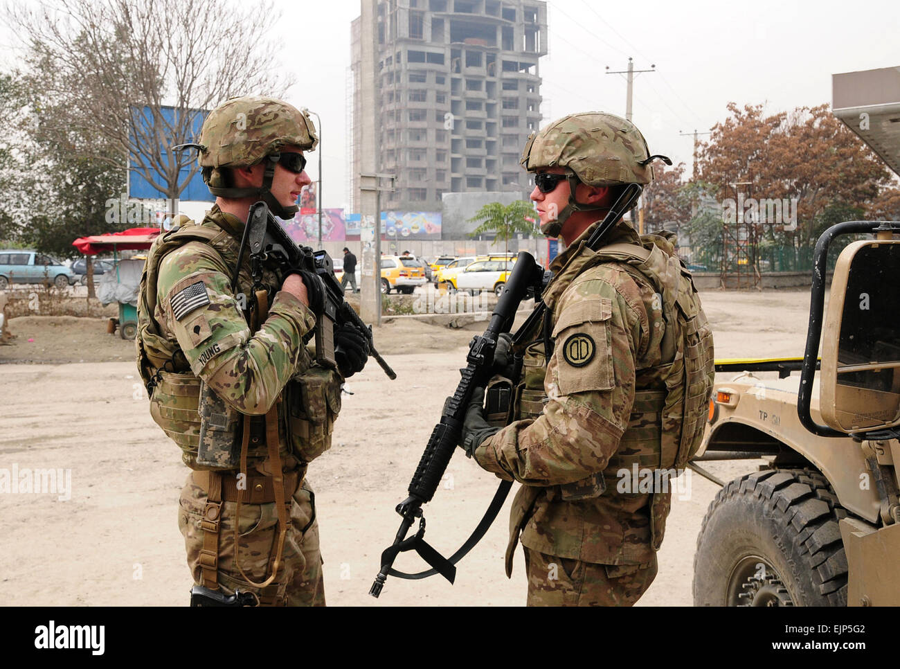 Task Force Spartan 3 soldier Army Spc. Daniel Fowler right provides ...