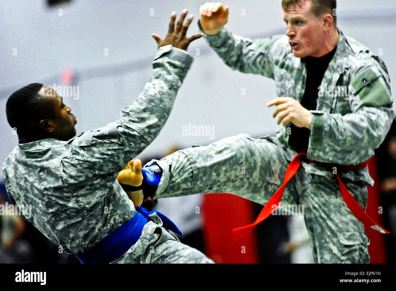 First Lt. Daniel Midgett of the 5th Special Forces Group, right, kicks ...