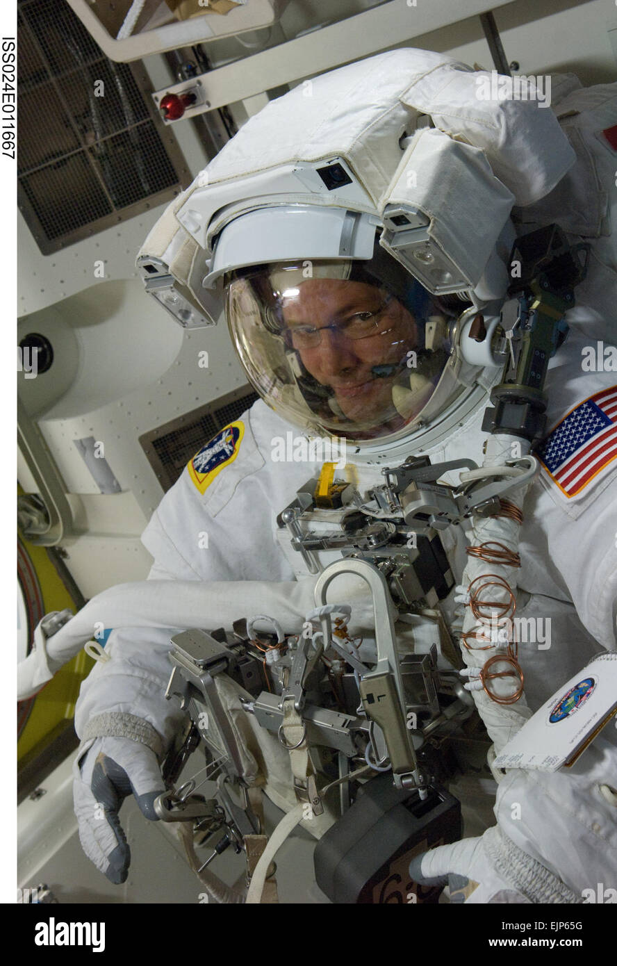 NASA astronaut Doug Wheelock, Expedition 24 flight engineer, attired in ...
