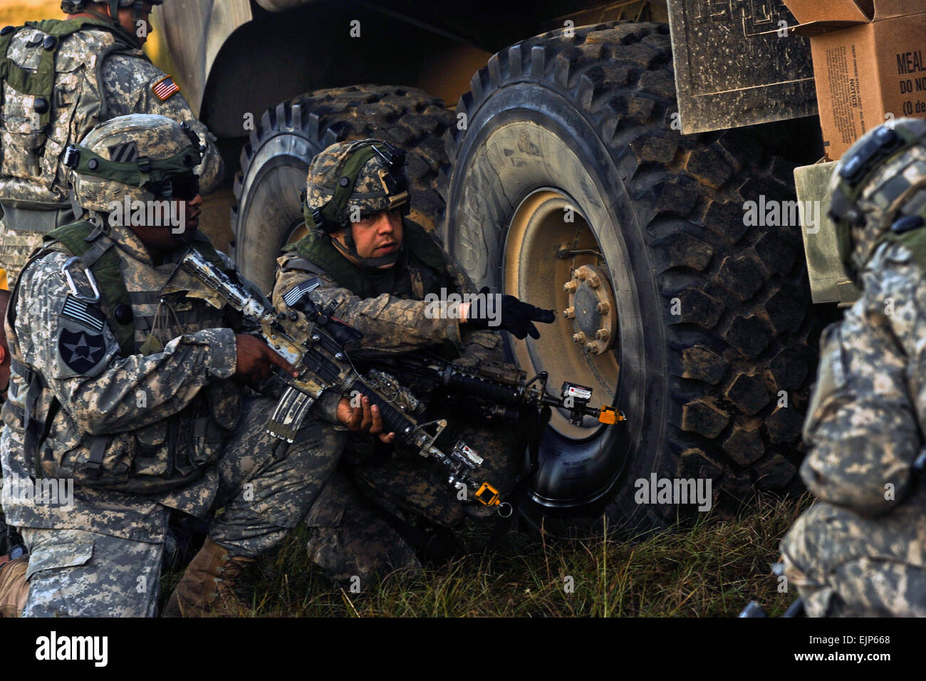 U.S. Army personnel provide security while overcoming a ground attack ...