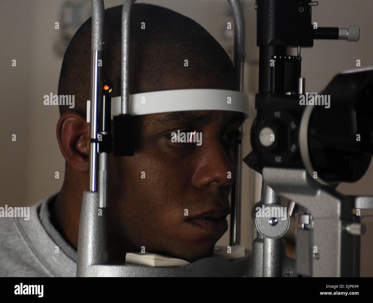 U.S. Army Pvt. Michael Ammond Jr. has his vision examined during in ...