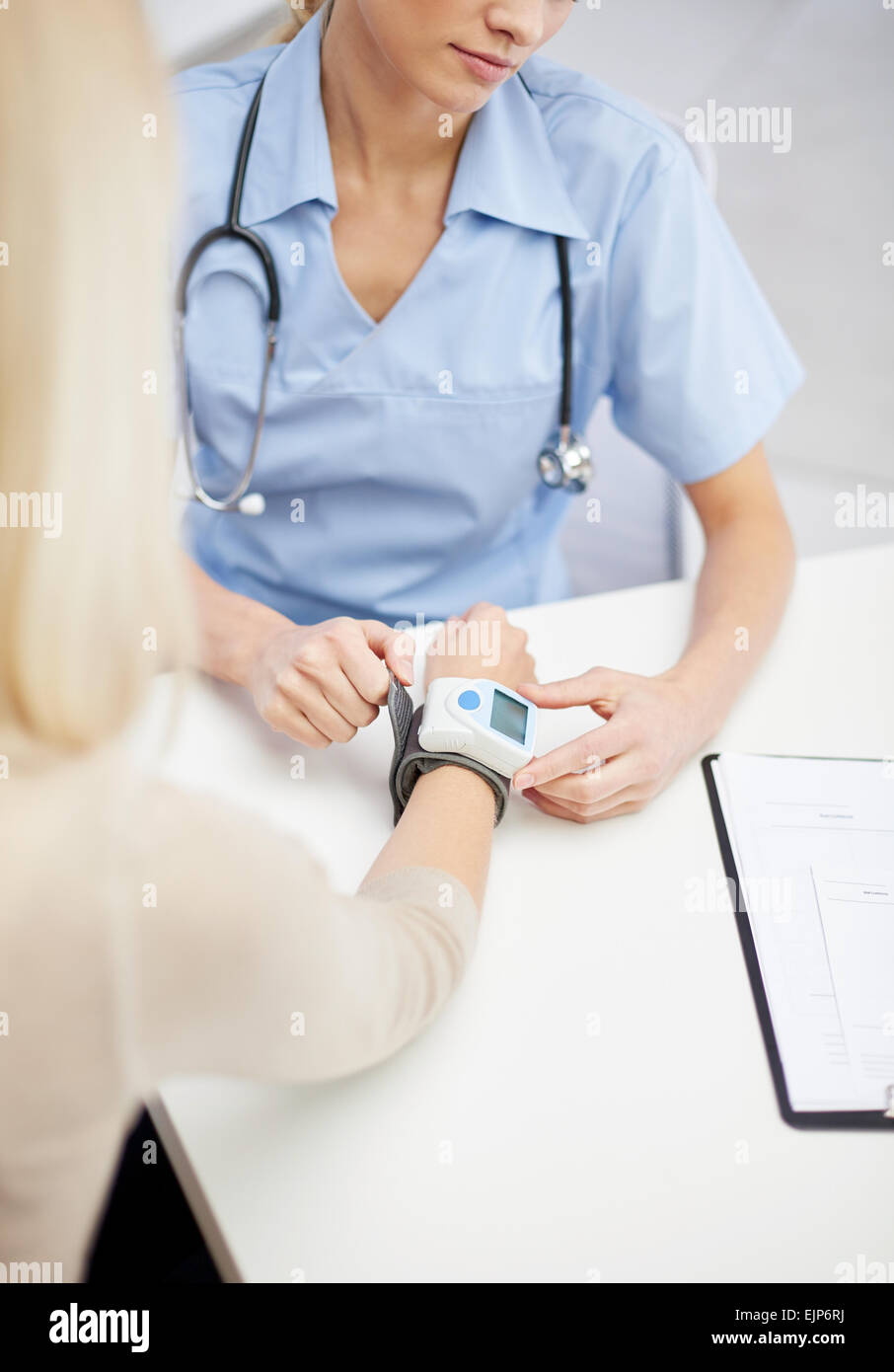 close up of doctor measuring pulse to patient Stock Photo - Alamy