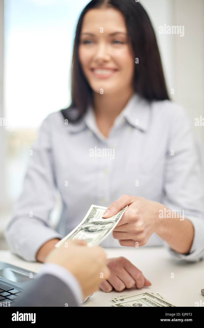 close up of happy woman giving or exchanging money Stock Photo - Alamy