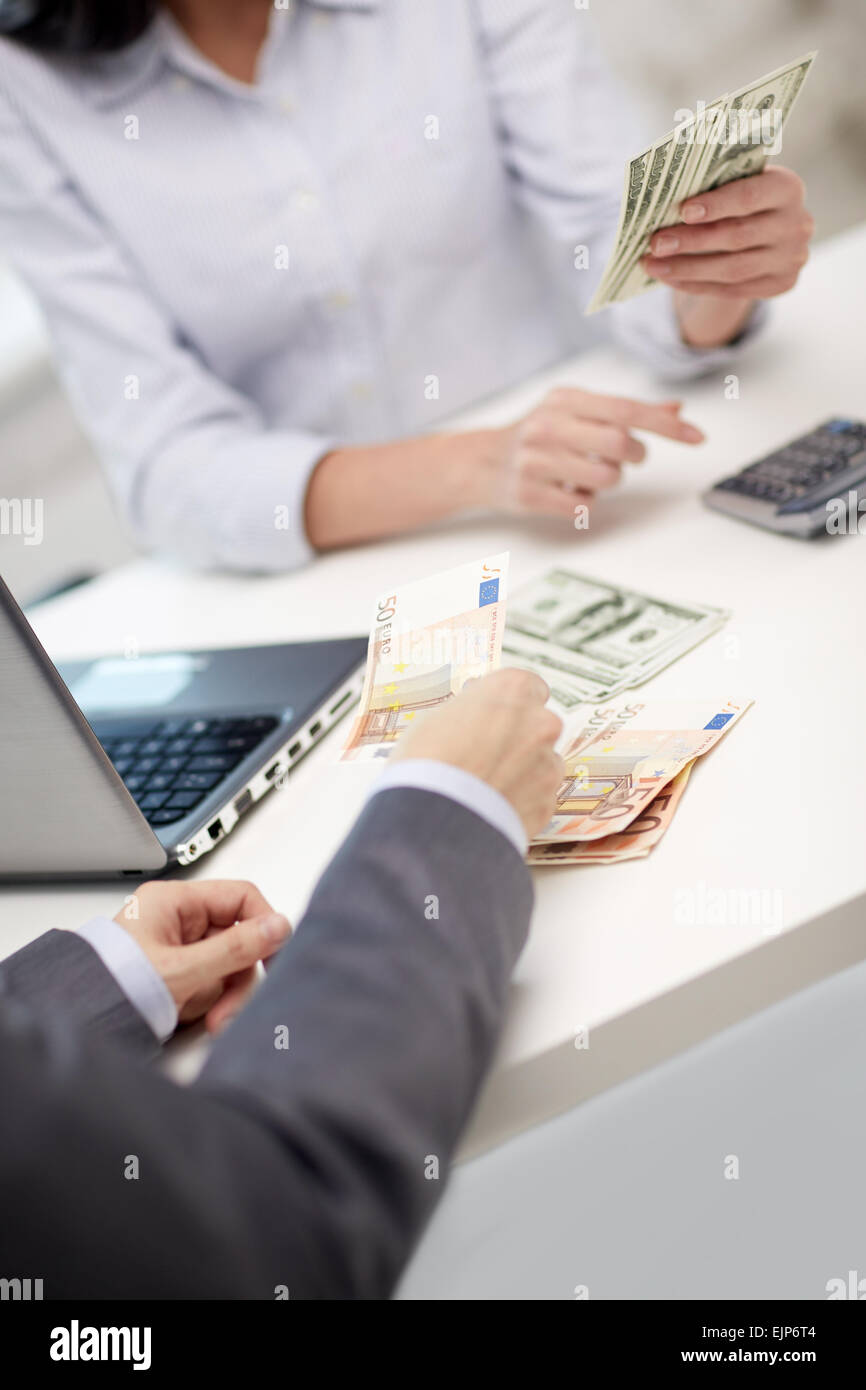close up of hands counting money with calculator Stock Photo - Alamy
