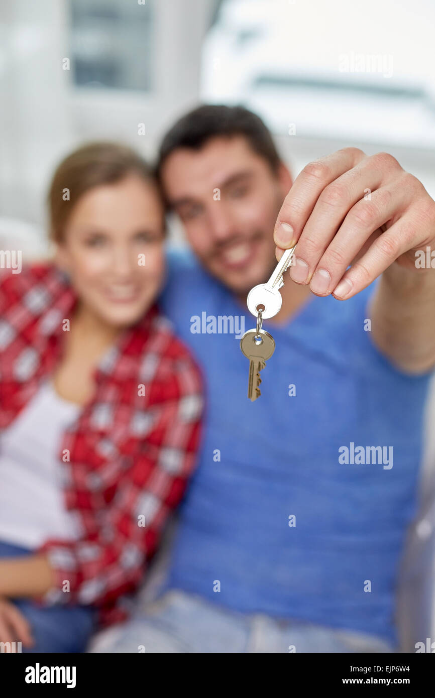 close up of happy couple showing key at home Stock Photo - Alamy