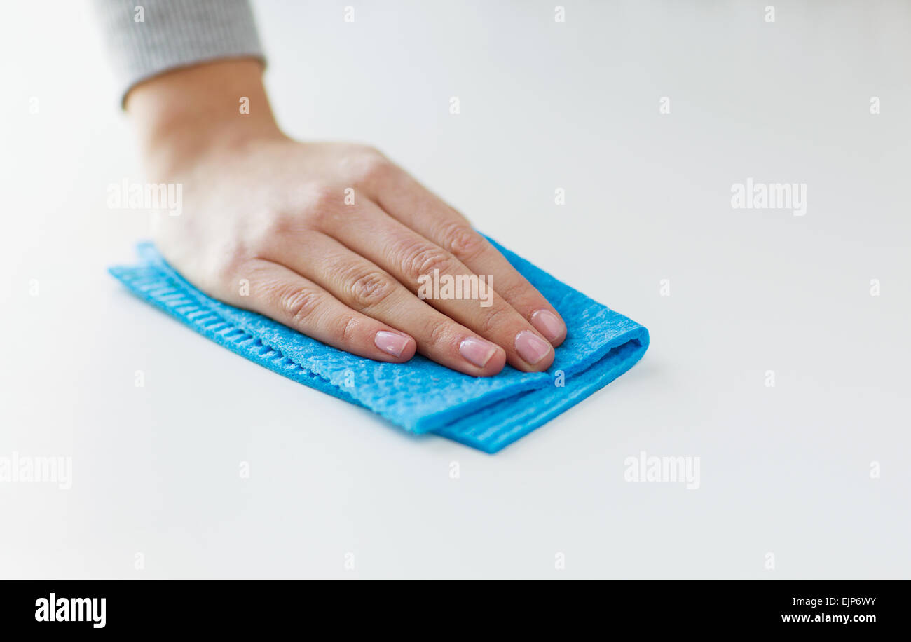 close up of hand cleaning table surface with cloth Stock Photo - Alamy