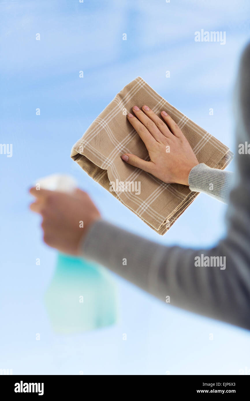 close up of woman hands cleaning window with cloth Stock Photo - Alamy