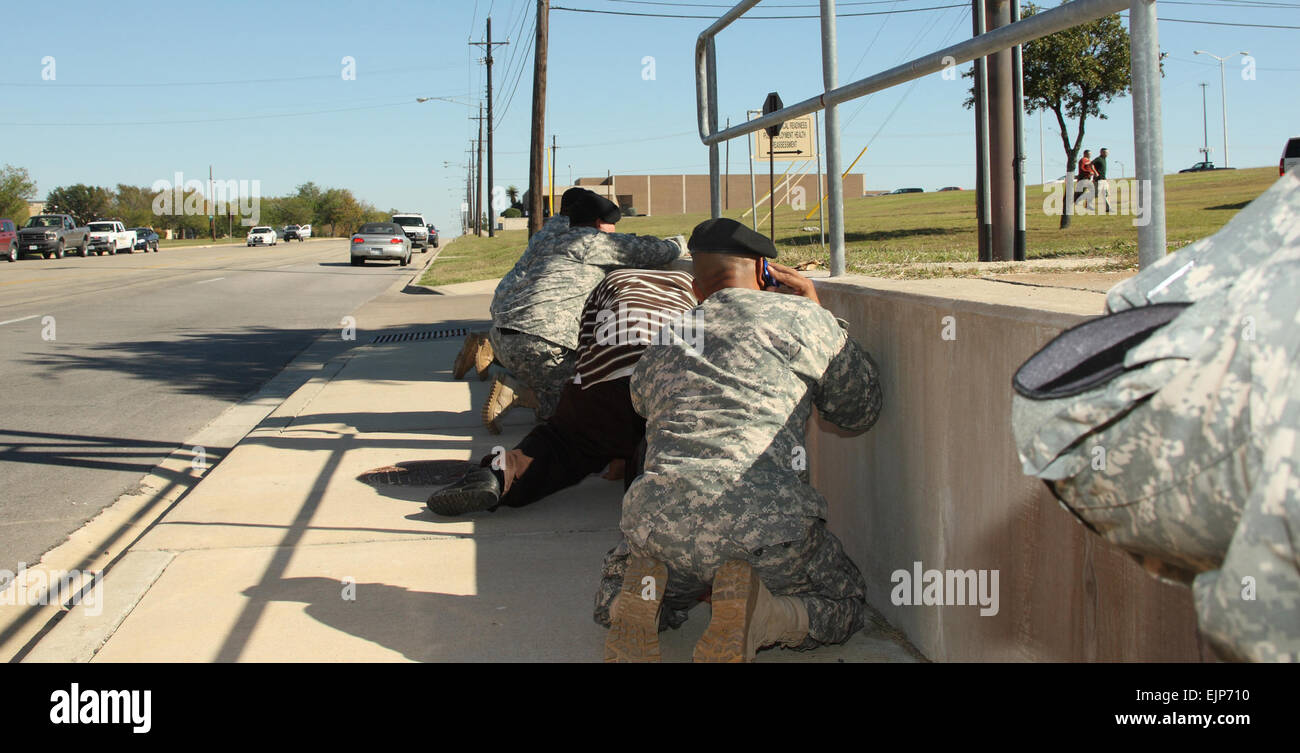 Bystanders crouch for cover as shots rang out from the Soldier ...