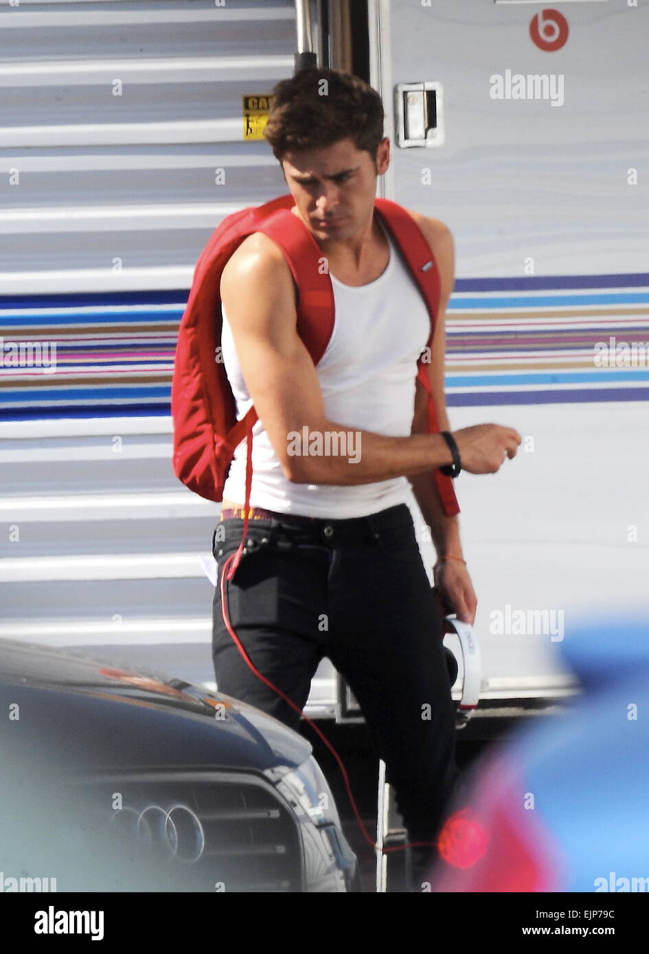 Actor Zac Efron shows off his biceps while on the set of his new movie ...