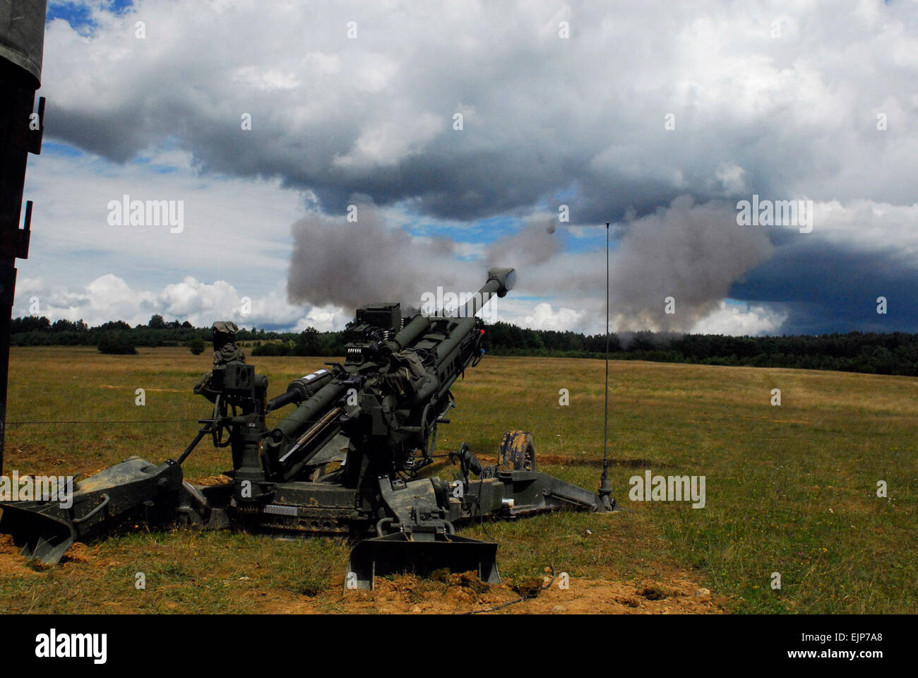 Soldiers from the 2nd Stryker Cavalry Regiment fire the M777 Howitzer ...