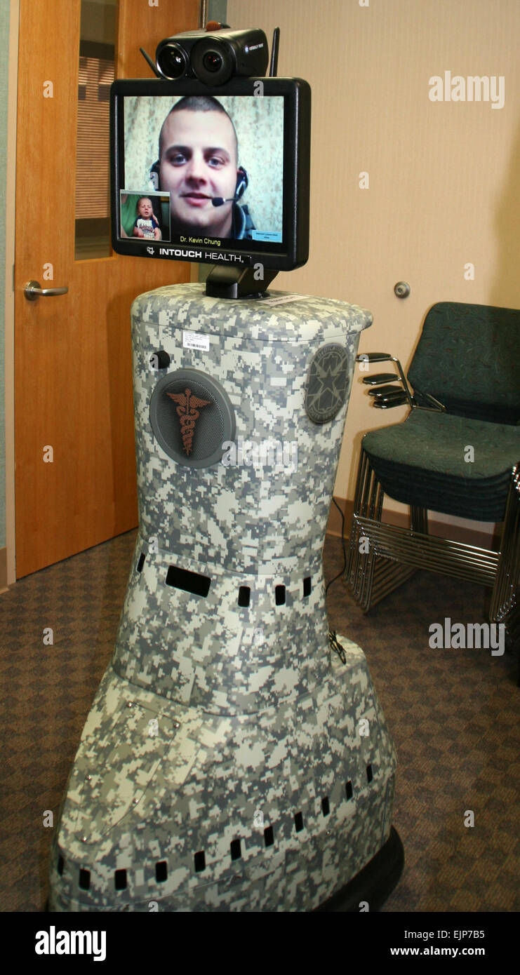 Army Staff Sgt. Erik Lloyd's face is displayed through an RP-7 robot at ...